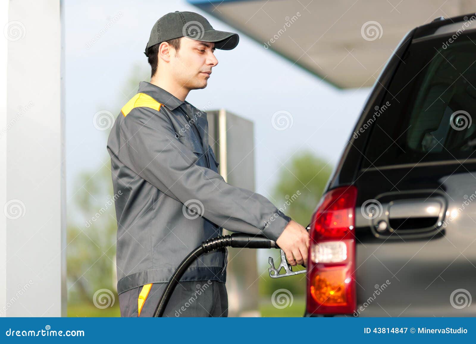 Gas Station Worker Refilling Car at Service Station Stock Image - Image ...