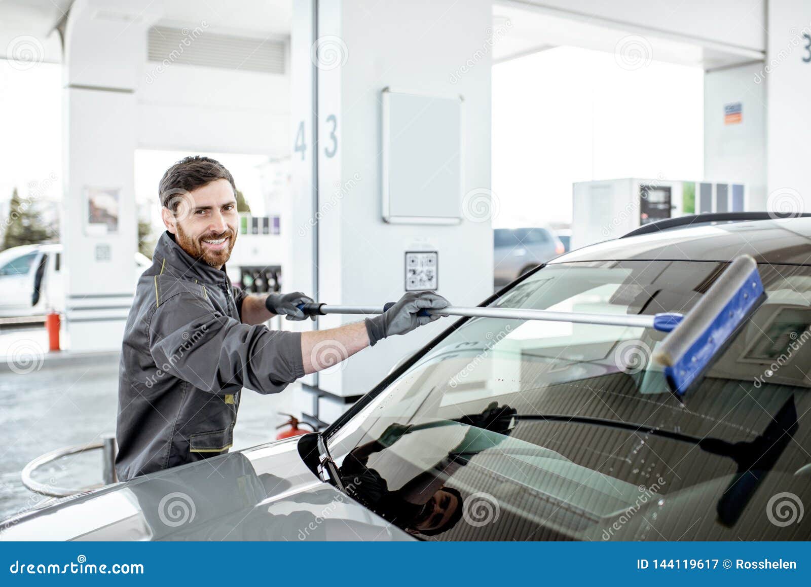 Worker Washing Car Windshield at the Station Stock Image - Image of ...