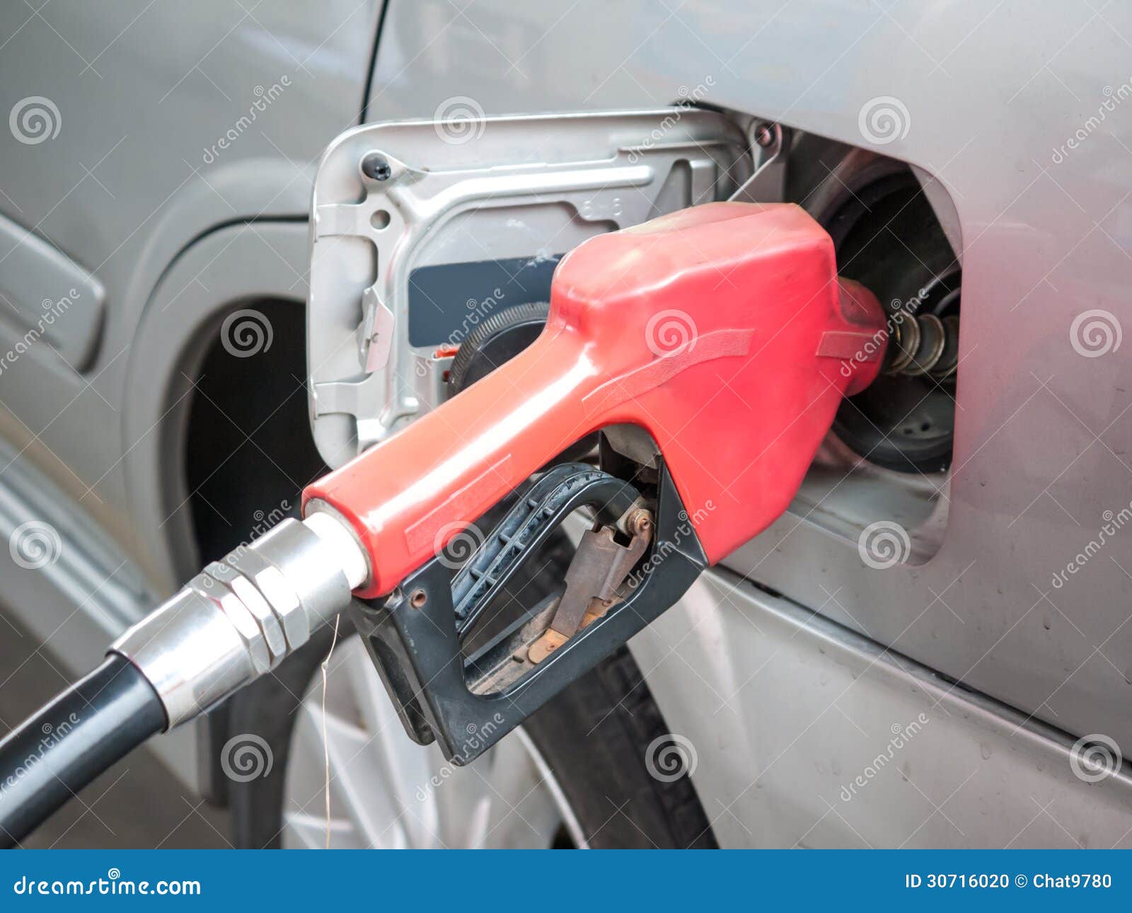 Gasoline Nozzle Filling Up a Car Stock Photo - Image of vehicle, nozzle ...