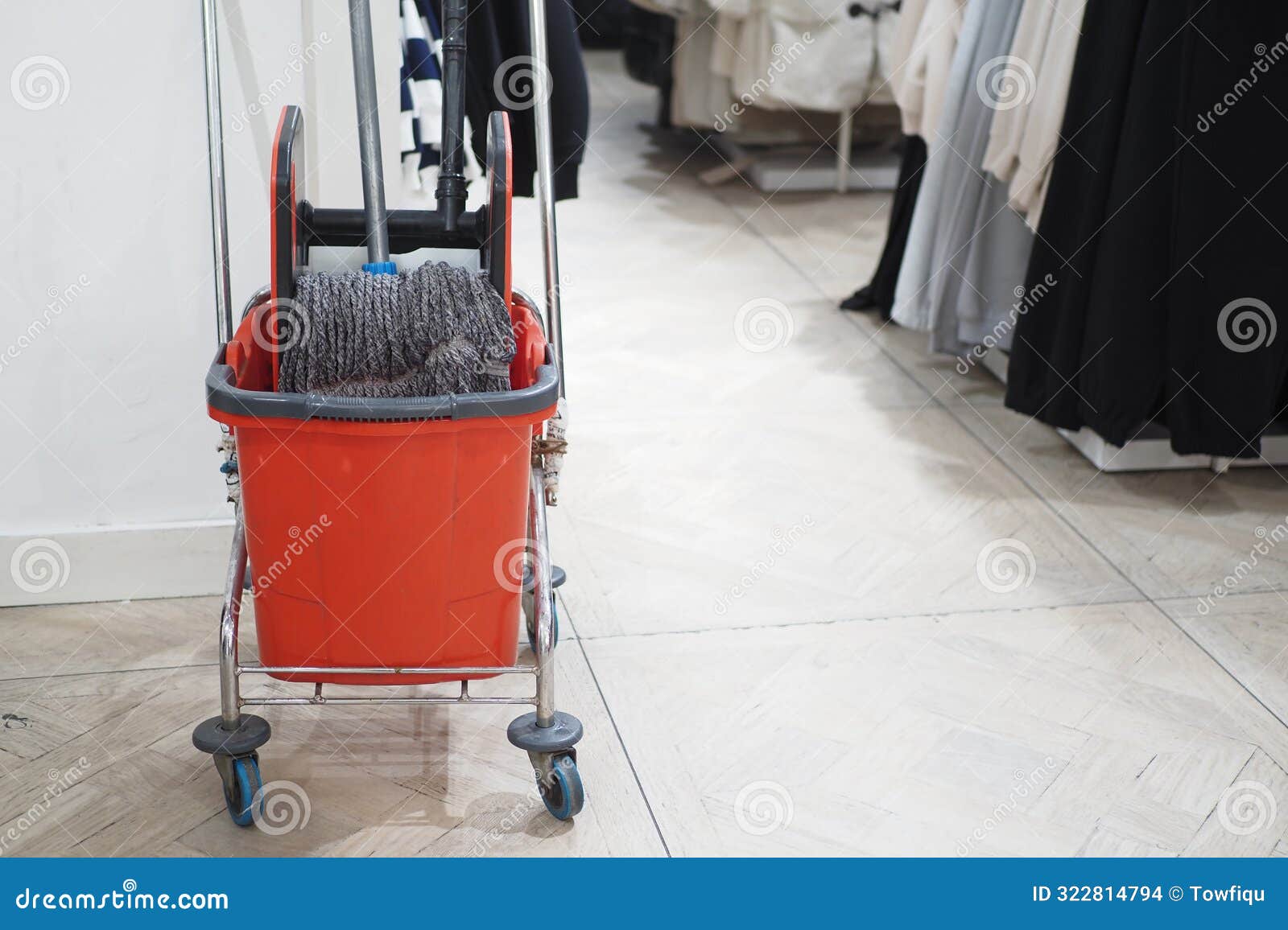 A Gaspowered Cleaning Machine with a Rolling Cart, Broom, and Mop Stock ...