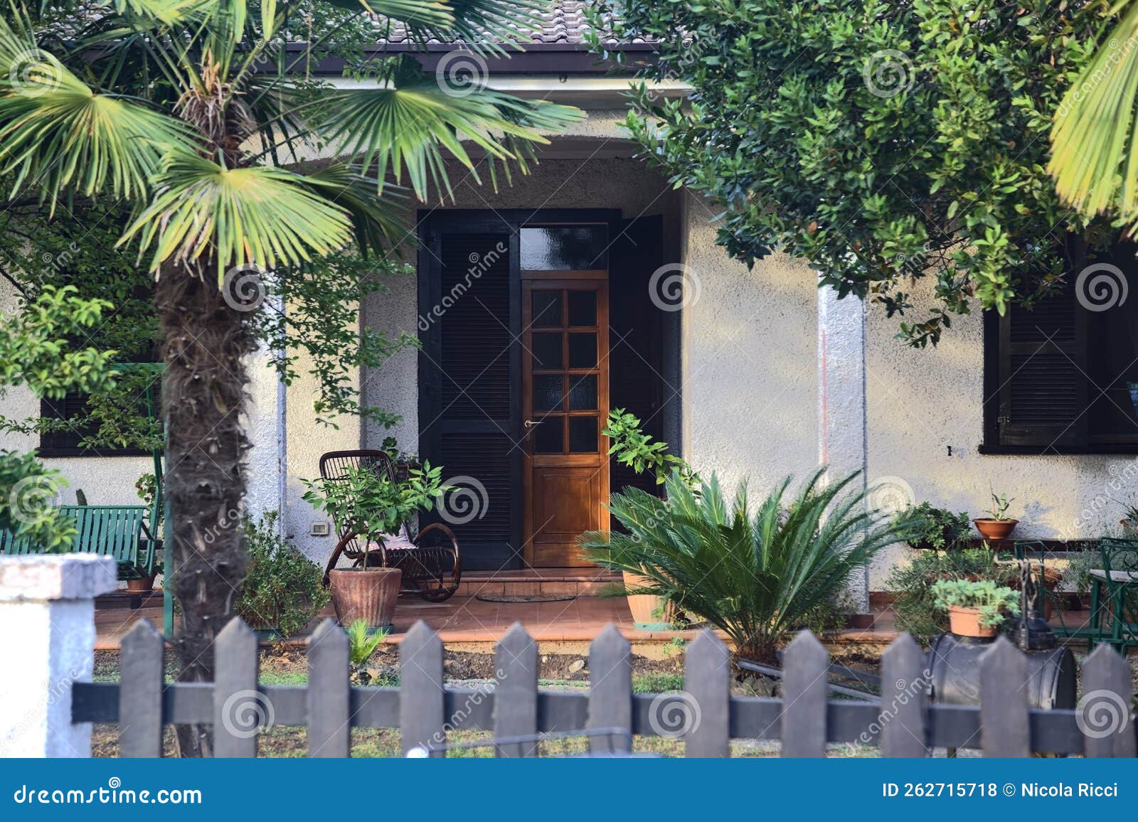 Gate and Door with Plants Surrounding Them Stock Photo - Image of door ...