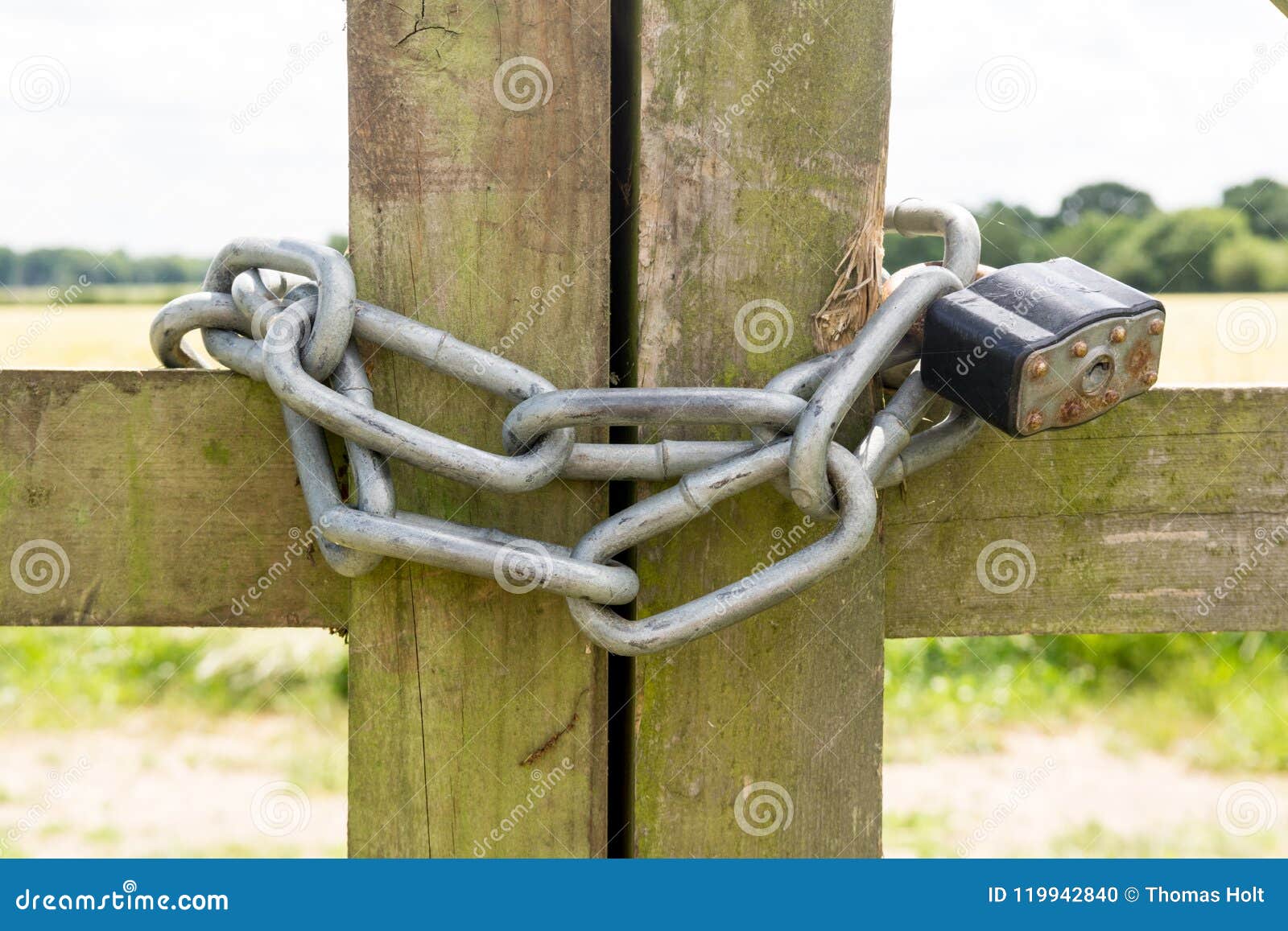 Gate Locked with a Metal Chain and Padlock Stock Photo - Image of ...
