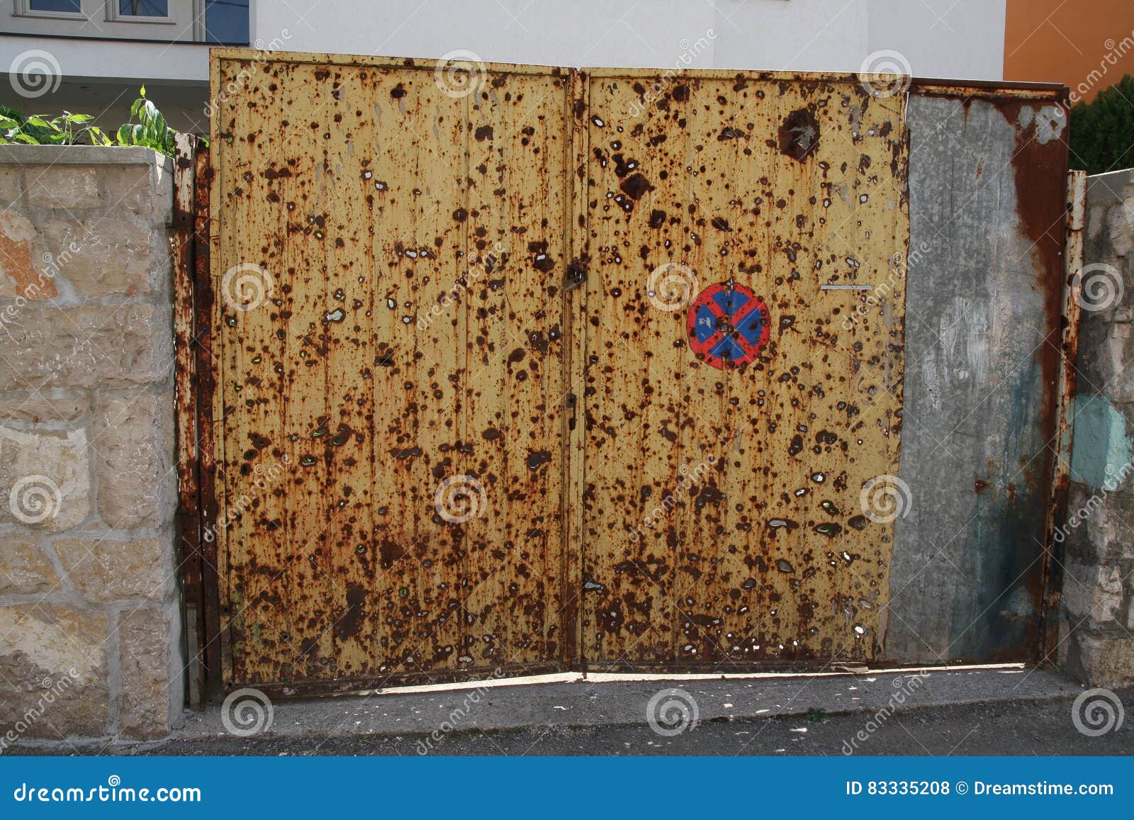 Gate riddled with bullets stock photo. Image of shoot - 83335208