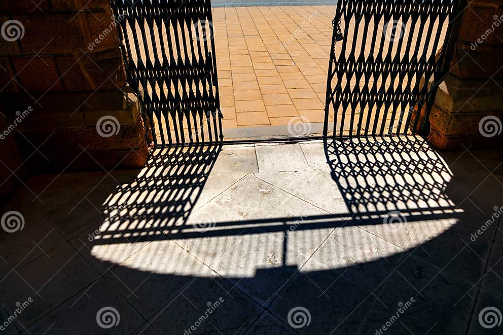 Gate shadow stock image. Image of shade, design, ground - 322543683