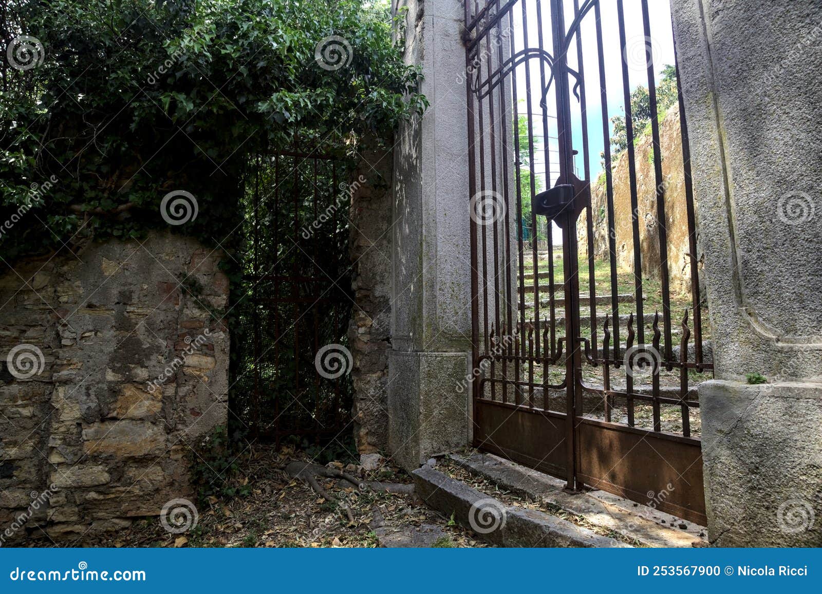 Gate in a Stone Wall at the End of a Path Stock Photo - Image of ...