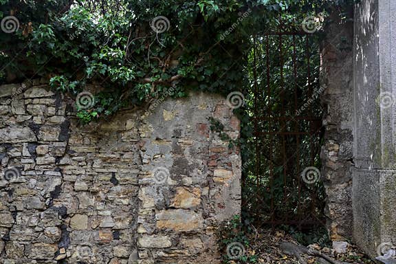 Gate in a Stone Wall at the End of a Path Stock Image - Image of glow ...