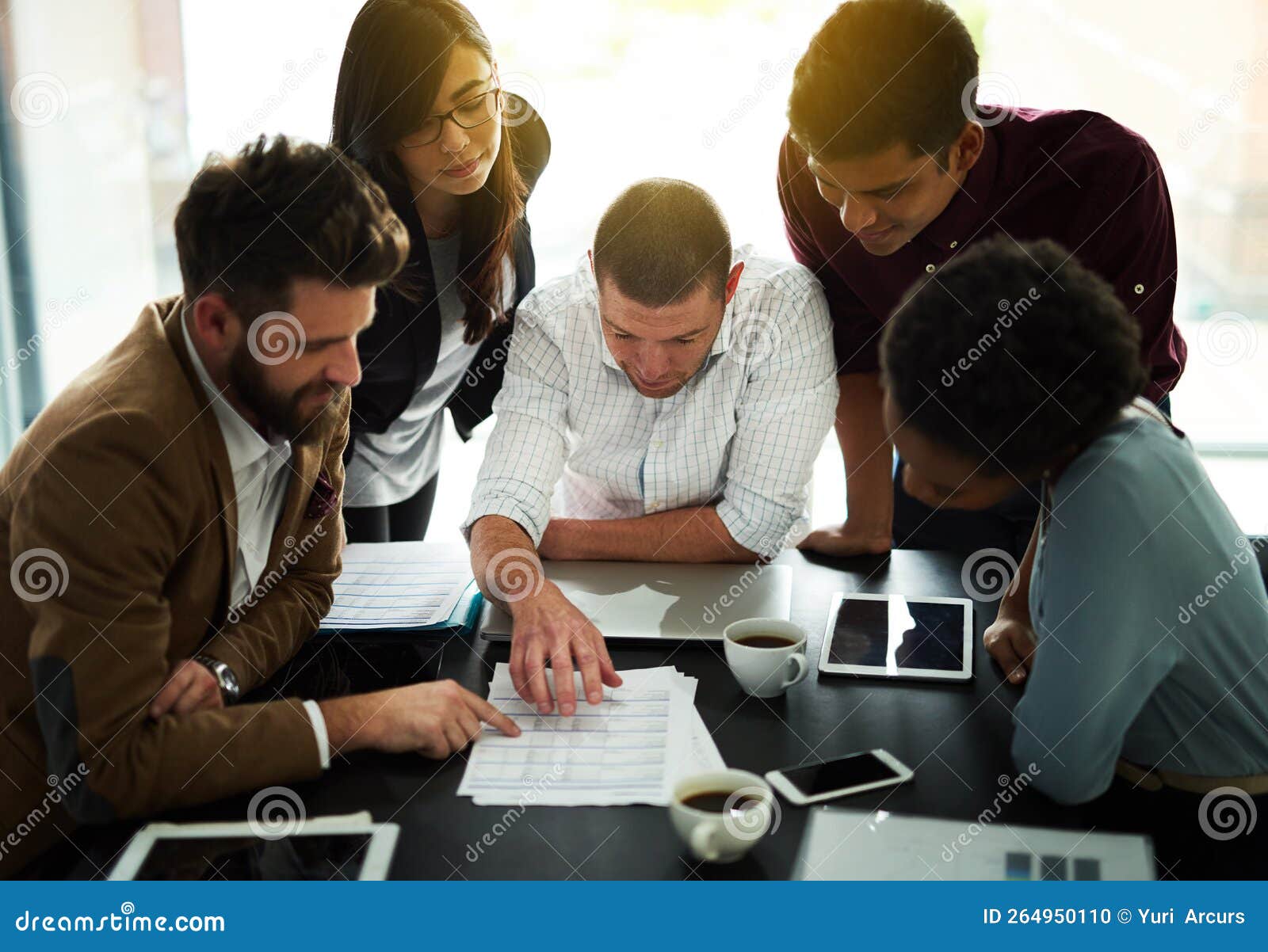 Gathering Everyones Input. a Group of Colleagues Having a Meeting in an ...