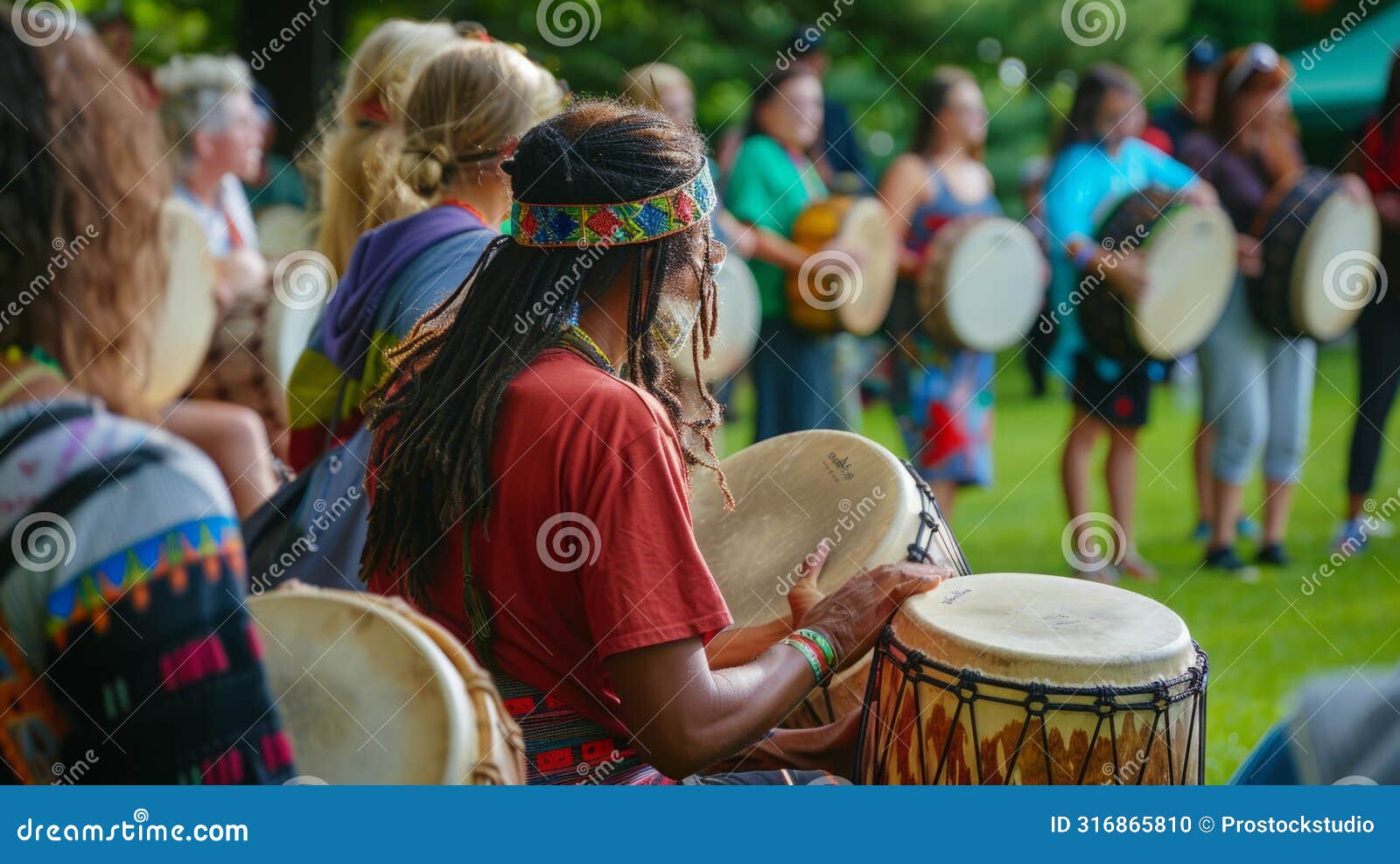 Group of People Sitting in the Grass Playing Musical Instruments Stock ...