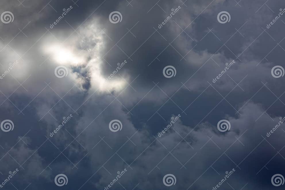 Gathering Storm Clouds Illuminated by the Sun Stock Photo - Image of ...