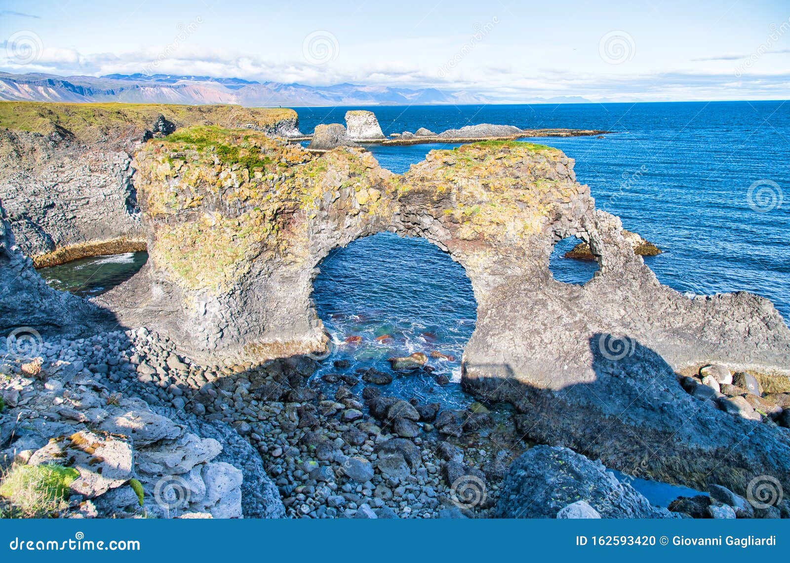 Gatklettur, Natural Arch Rock In The Cliff Of Arnarstapi, Snaefellsnes ...