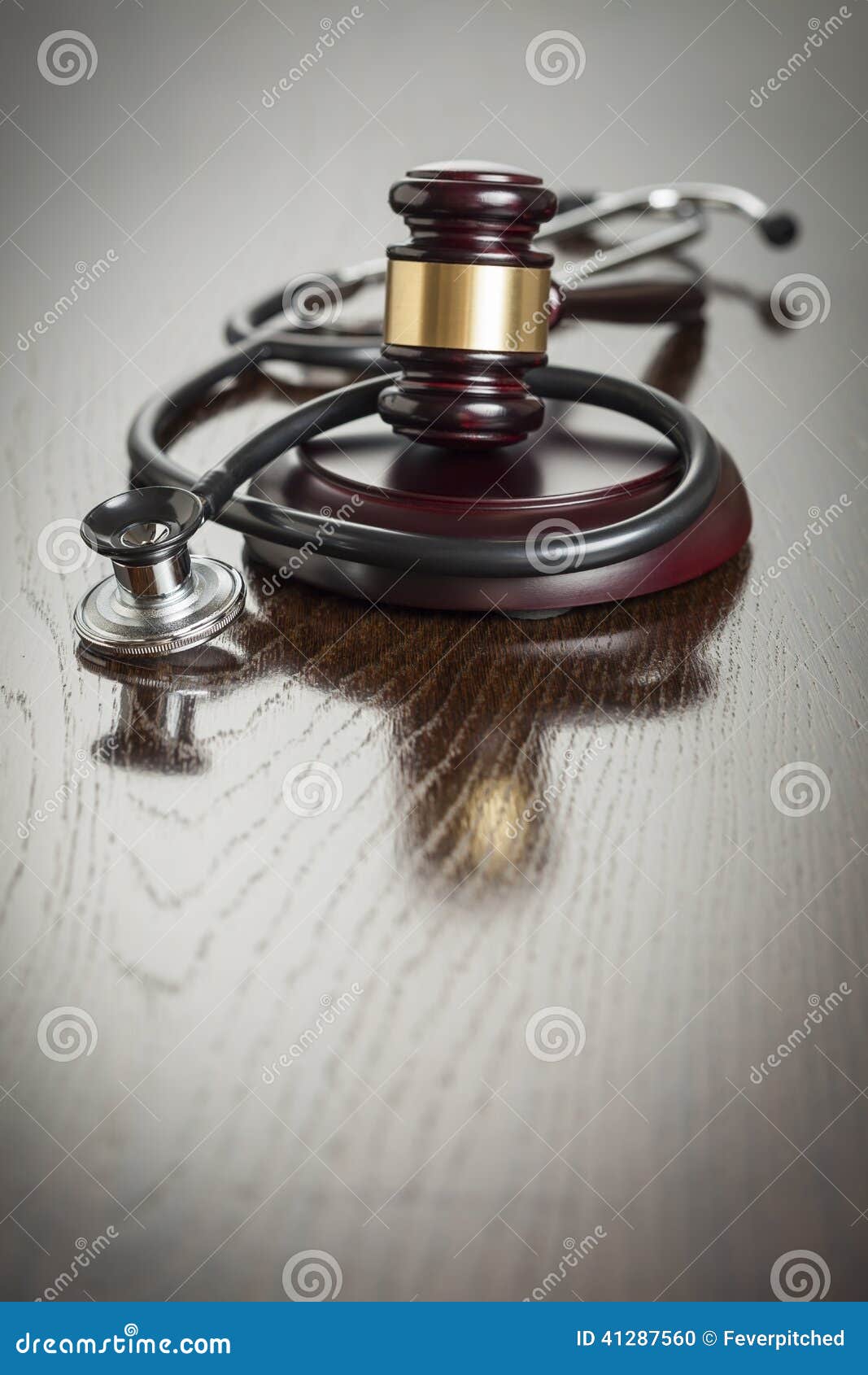 Gavel and Stethoscope on Reflective Table Stock Photo - Image of ...