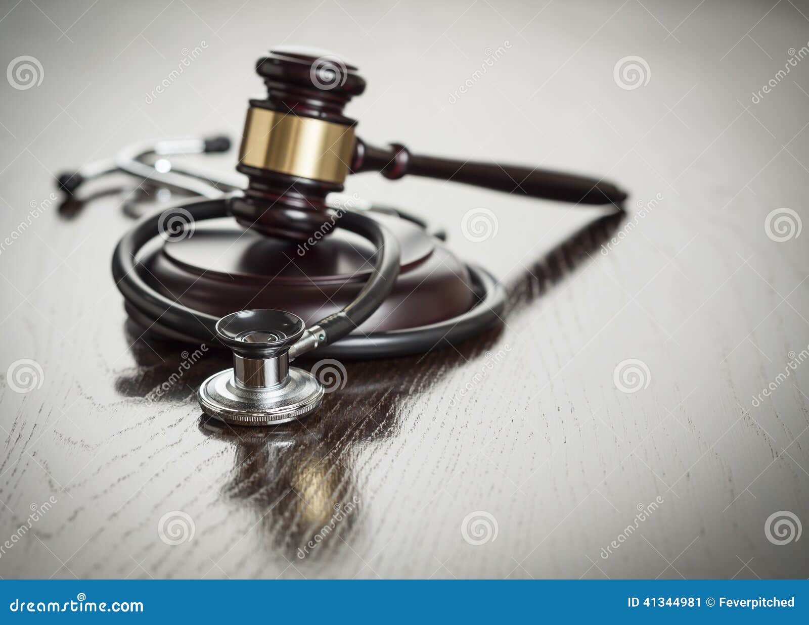 Gavel and Stethoscope on Reflective Table Stock Image - Image of ethics ...