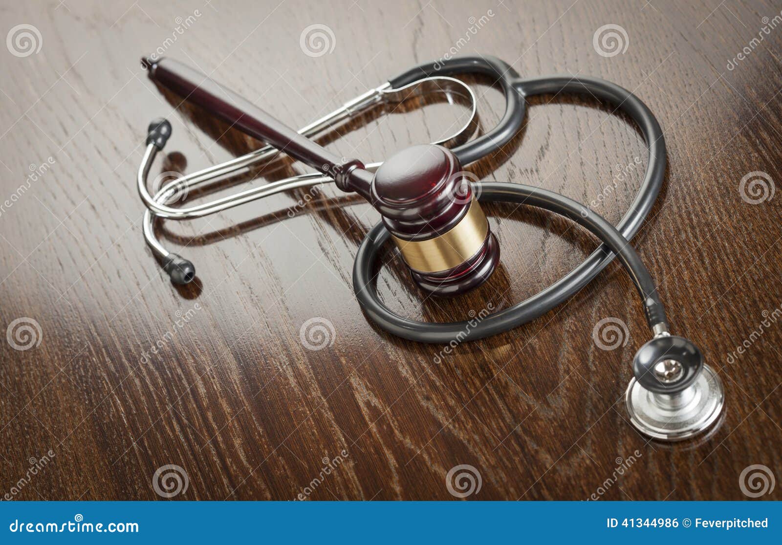 Gavel and Stethoscope on Reflective Table Stock Photo - Image of ...