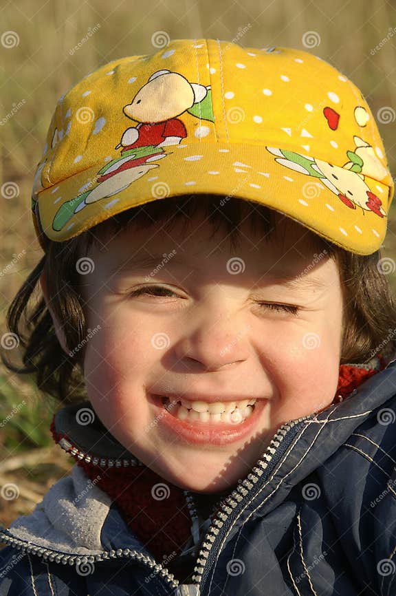Little boy in yellow cap stock image. Image of beautiful - 2382487