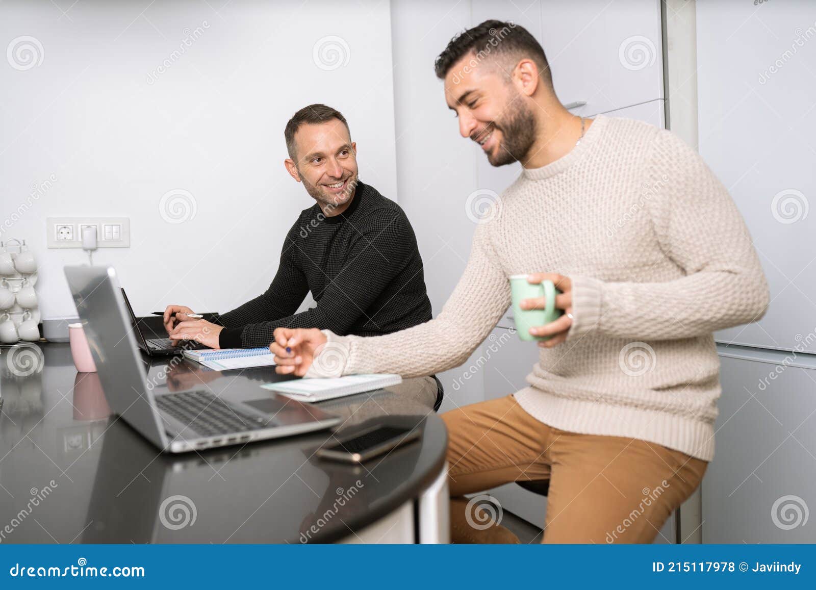 Gay Couple Working Together at Home with Their Laptops. Stock Photo ... Gay Couple Working Together at Home with Their Laptops. Stock Photo ...