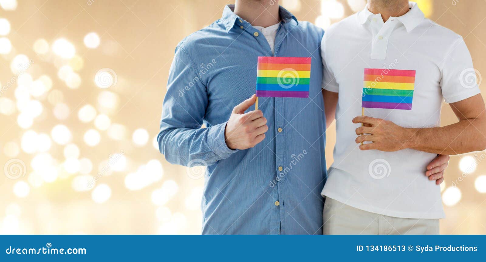 Close Up Of Male Gay Couple Holding Rainbow Flags Stock Image Image