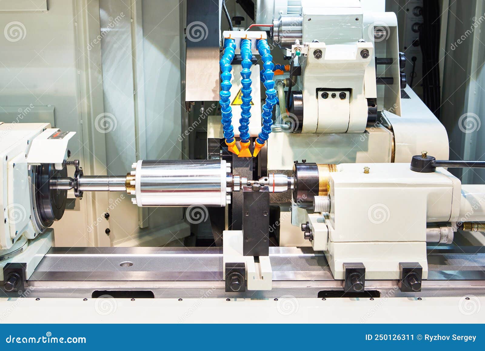 Gear Grinding Machine In Operation, Grinding Of Teeth Of A Wheel With ...
