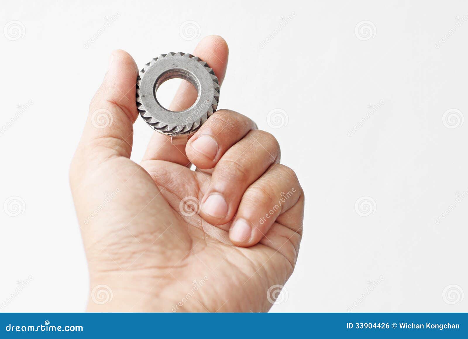Gear in hand stock photo. Image of system, metallic, mechanic - 33904426