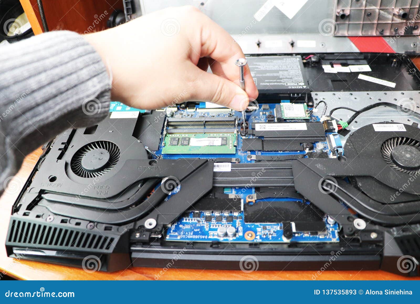 A Geek Cleans a Laptop Cooler. Contaminated Computer Cooling System ...