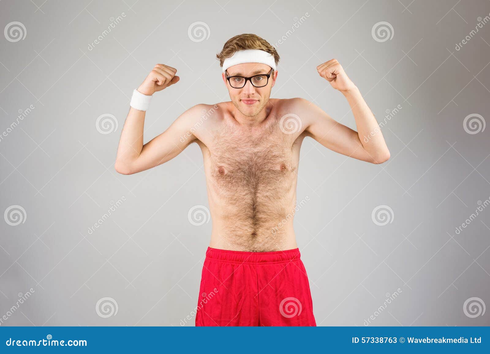 Geeky Shirtless Hipster Flexing Biceps Royalty-Free Stock Photo ...