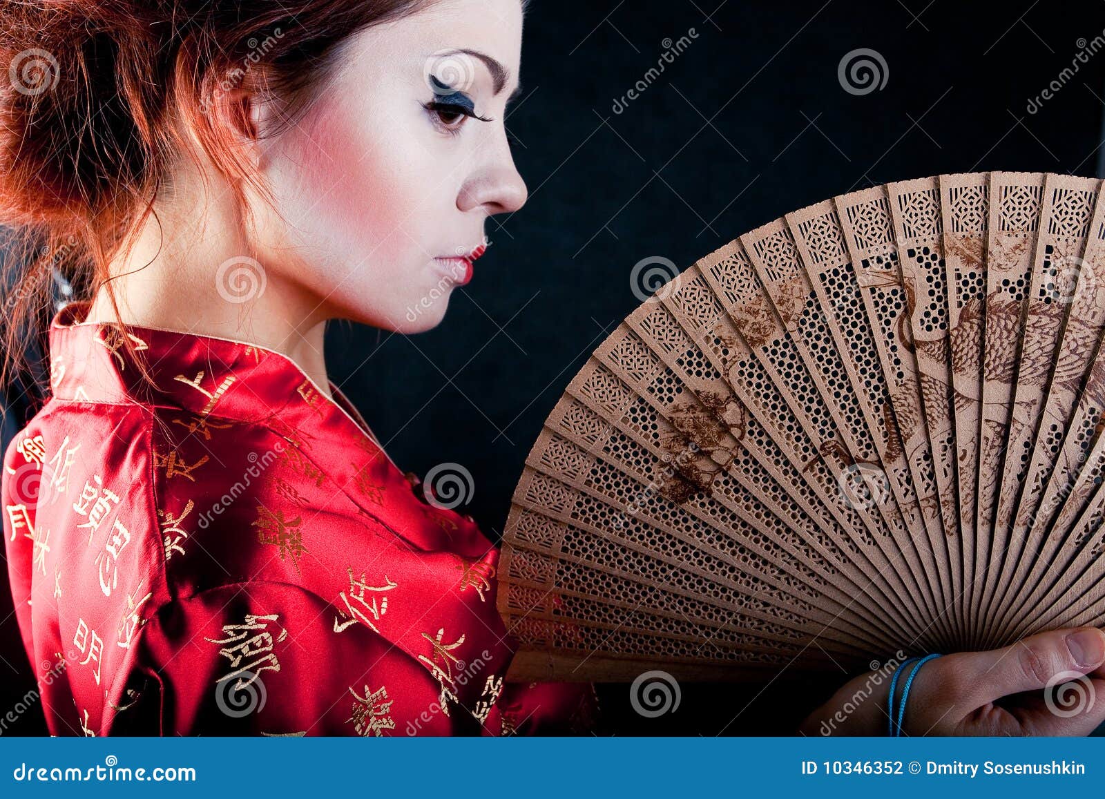 Geisha with wooden fan stock photo. Image of fashion - 10346352