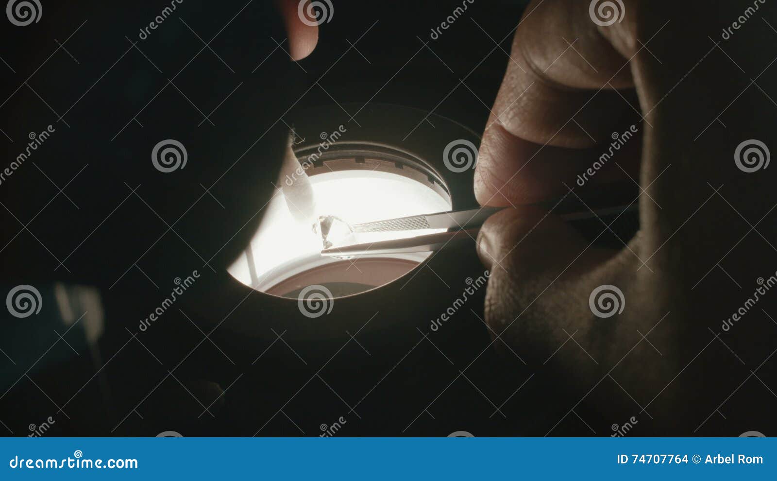 A Gemologist Inspecting a Large Diamond Under a Microscope Stock ...
