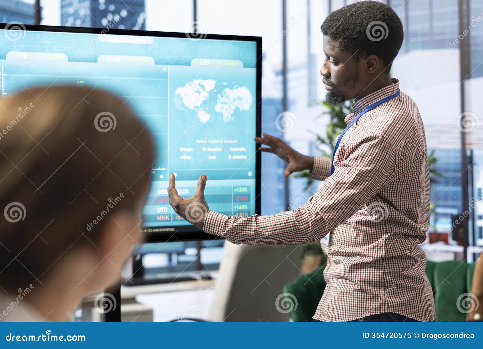 General Manager Making a Presentation with Infographics and Sales ...