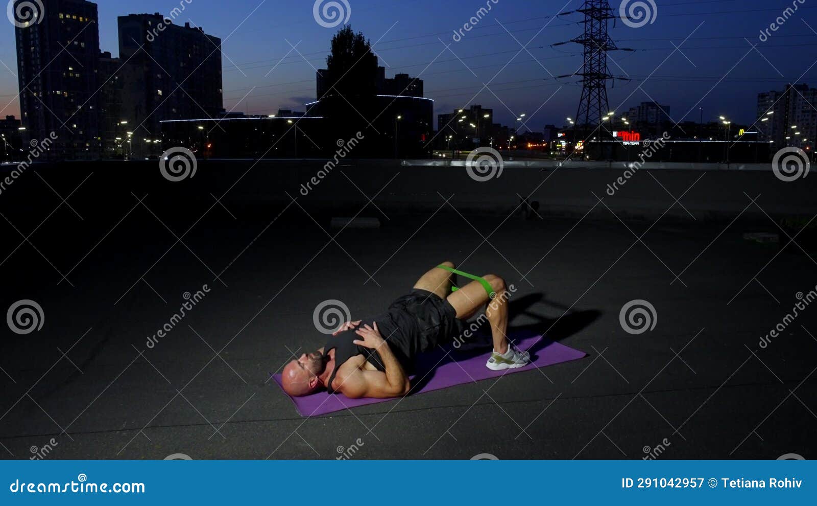 General Plan As an Athlete Performs an Exercise for Leg Using a Rubber ...