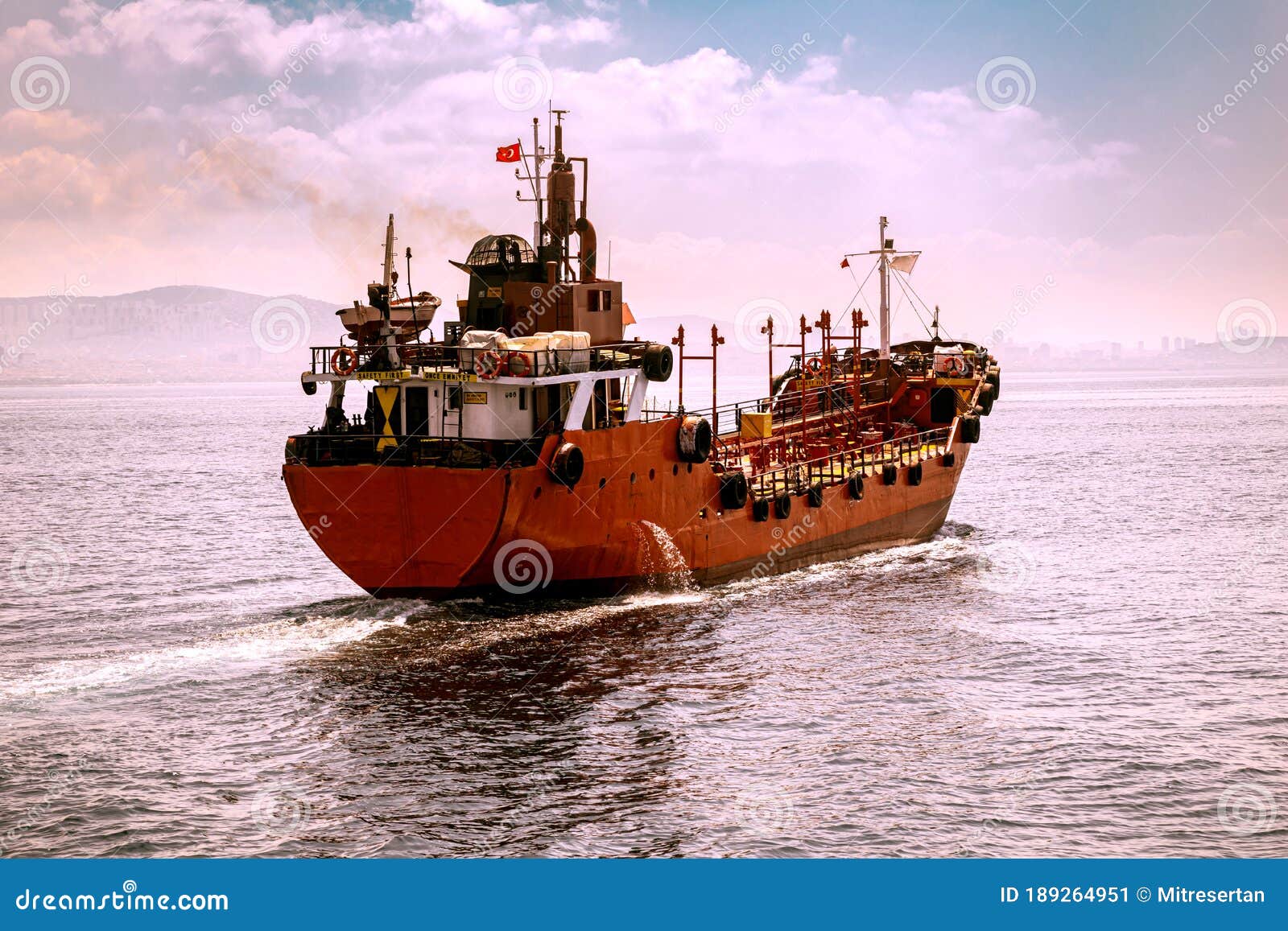 General Plan of a Very Large Red Ship Sails on the Sea, from Behind ...