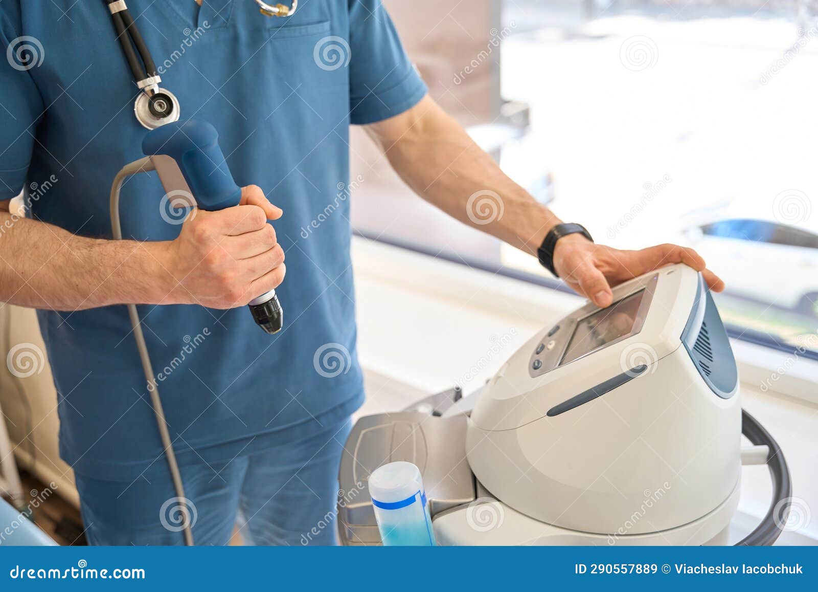 General Practitioner Adjusting Extracorporeal Shockwave Therapy Machine ...