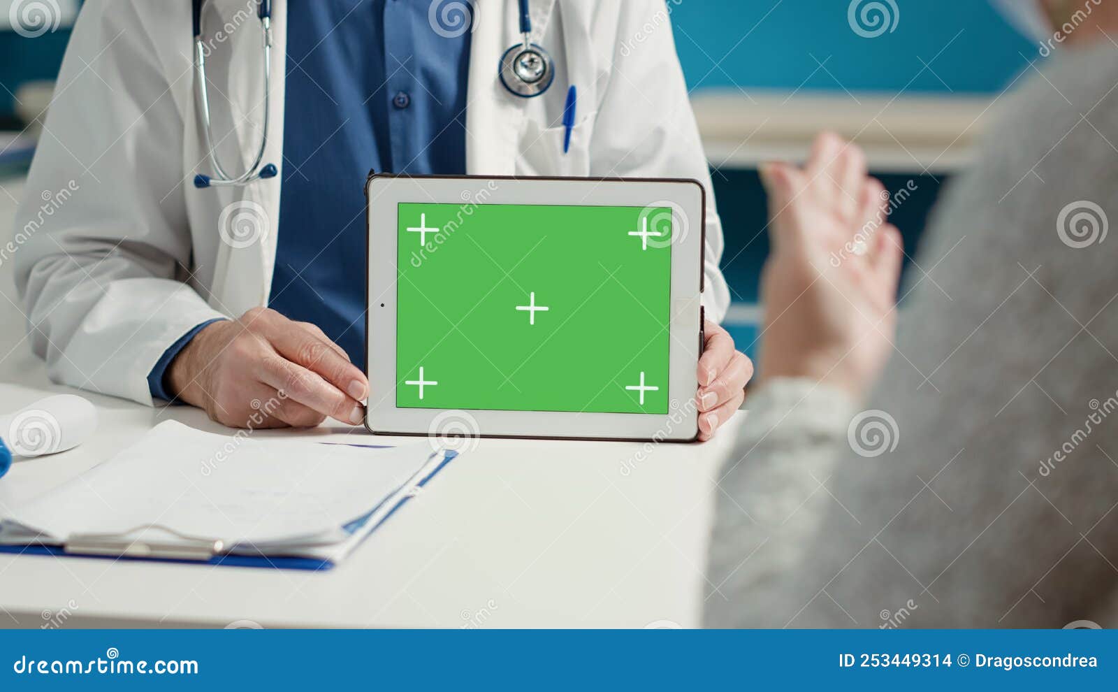 General Practitioner Holding Horizontal Greenscreen on Tablet Stock ...