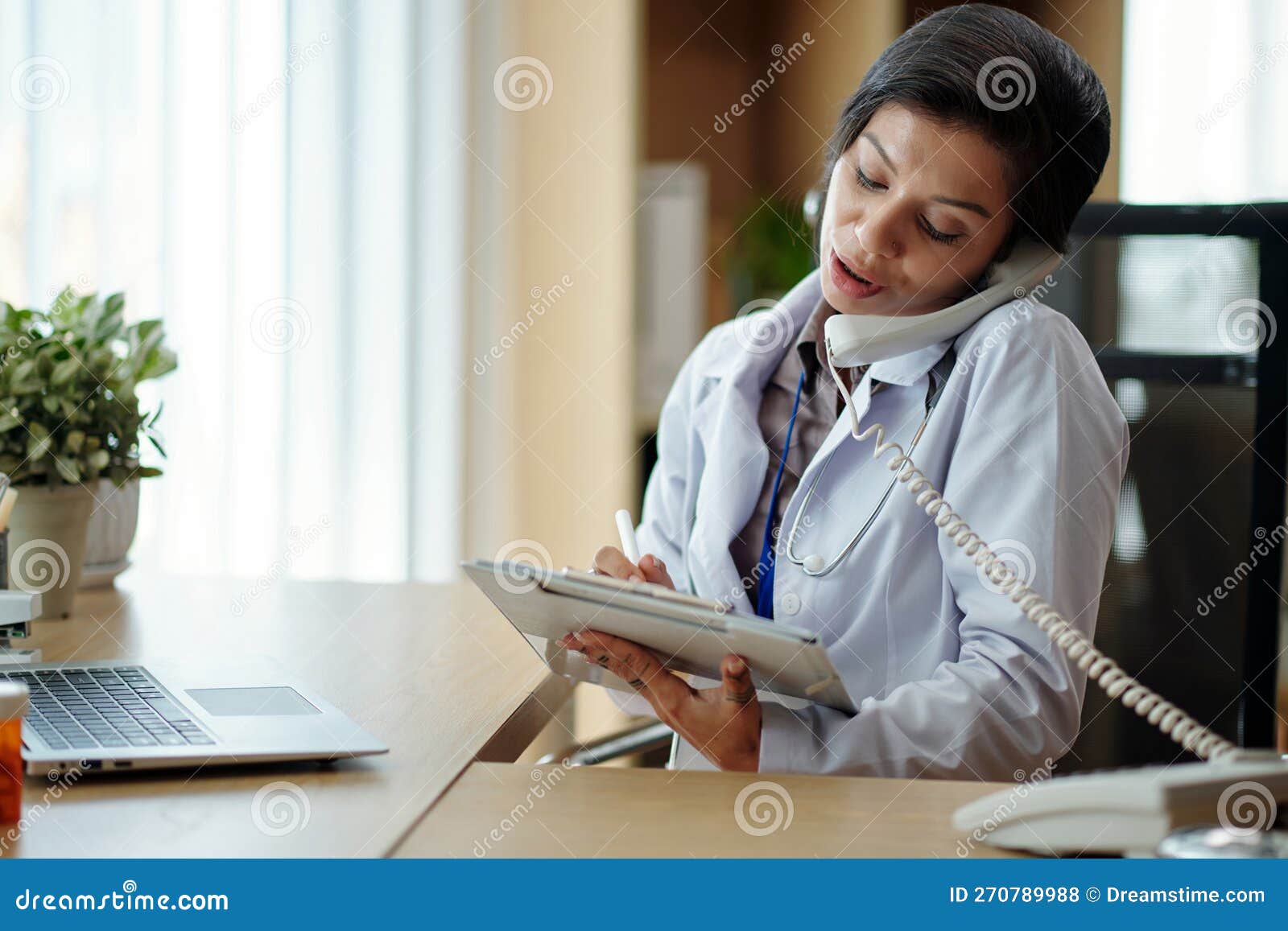 General Practitioner Calling Patient Stock Photo - Image of laptop ...