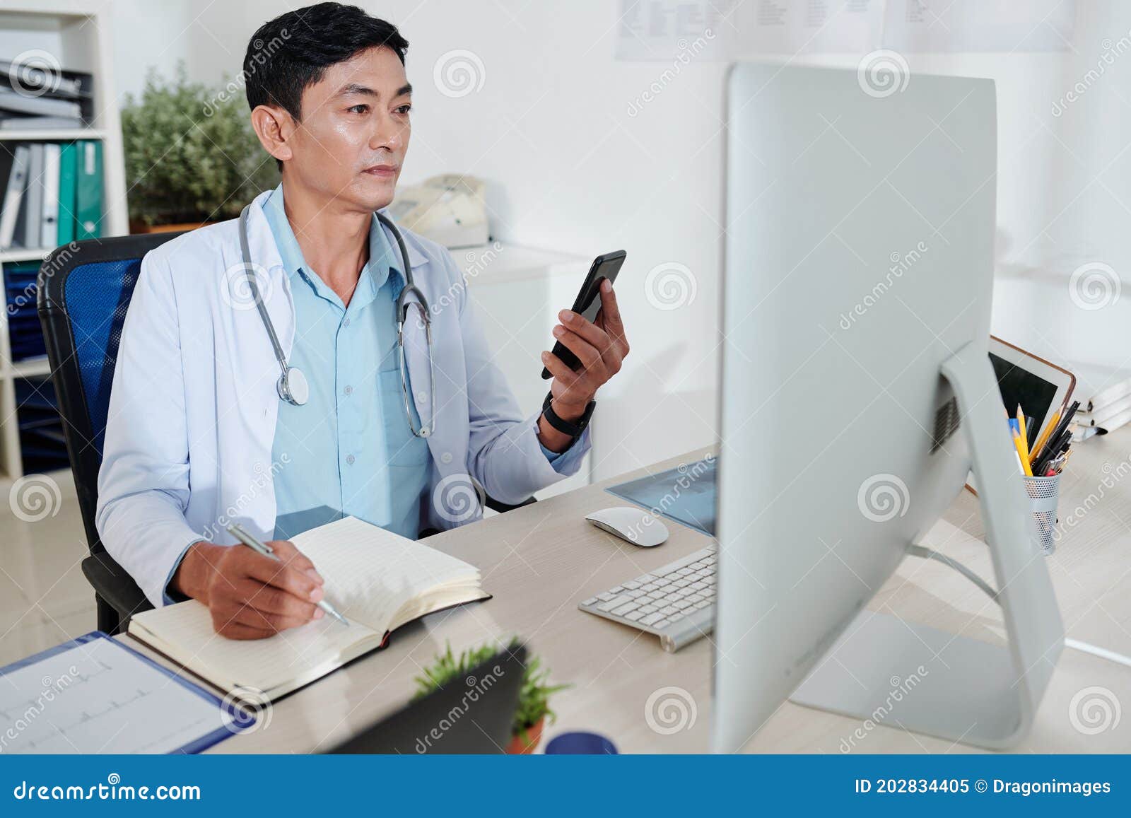 General Practitioner Working on Computer Stock Image - Image of online ...