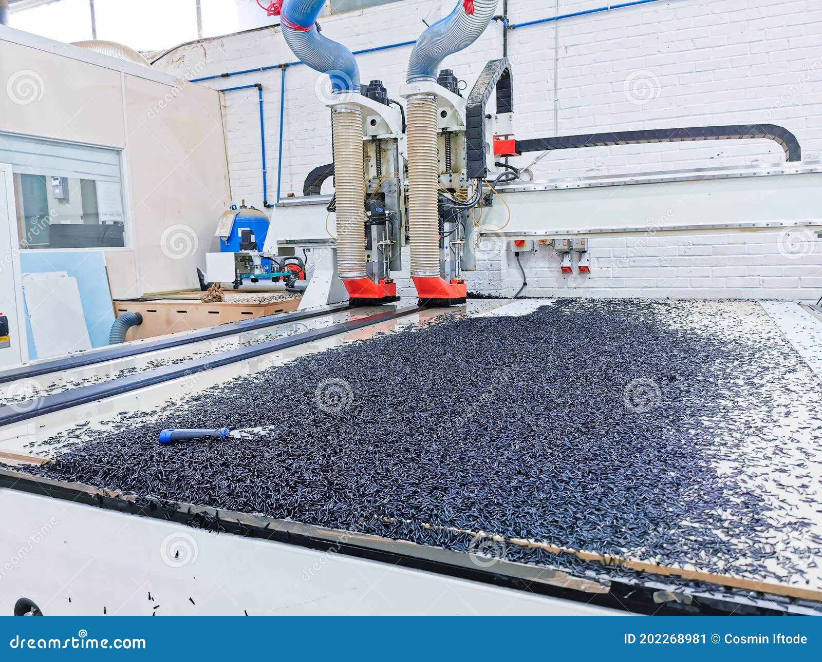 General View of a Factory CNC Machine Cutting through Polyethylene ...