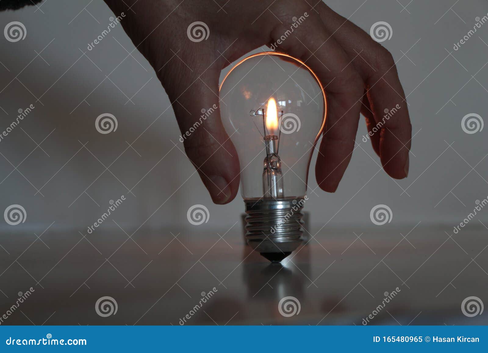 General View of Hand, Light Bulb and Candlelight. Stock Image - Image ...