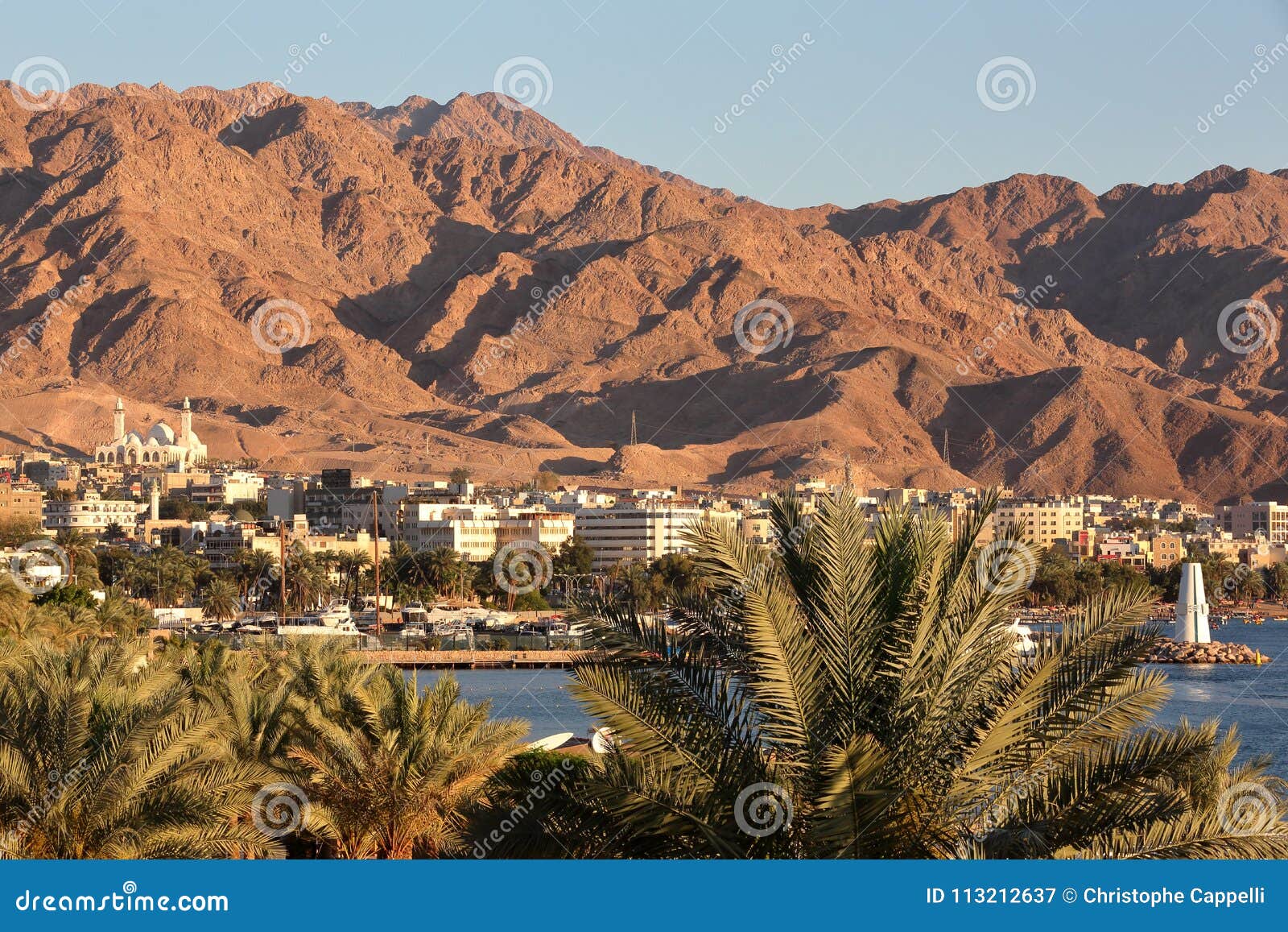 General View of the Town of Aqaba at Sunset with Palm Trees in the ...