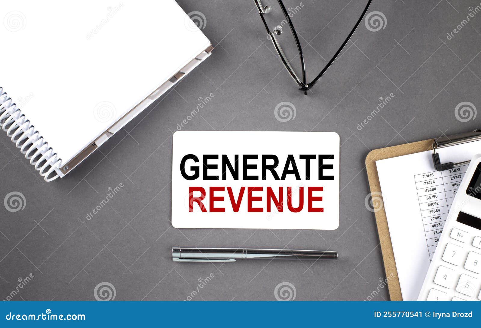 GENERATE REVENUE Text Written on the Card with Notebook and Clipboard ...