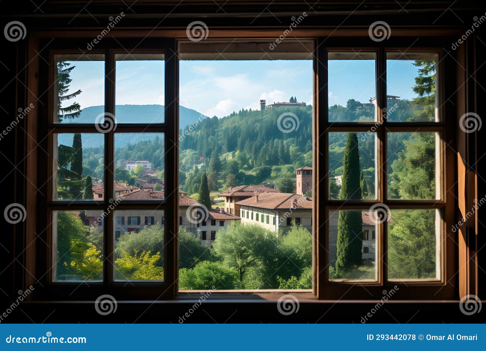 A View Out a Window of a Building with Mountains in the Background ...