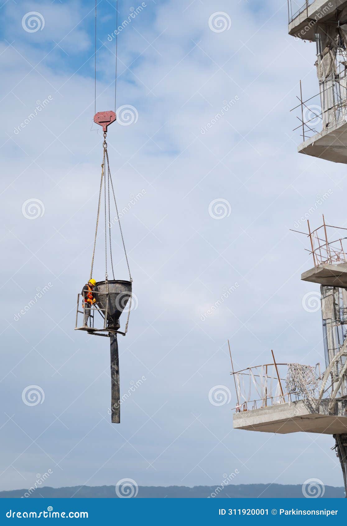 Construction Worker in a High-Rise Concrete Pouring Bucket Stock Image ...