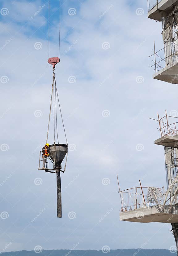 Construction Worker in a High-Rise Concrete Pouring Bucket Stock Image ...
