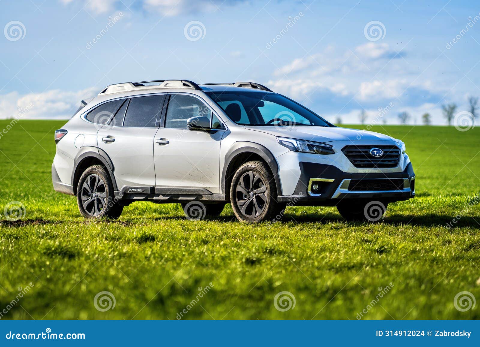 Subaru Outback Outside Off Road in Green Grass Meadow. Editorial Stock ...