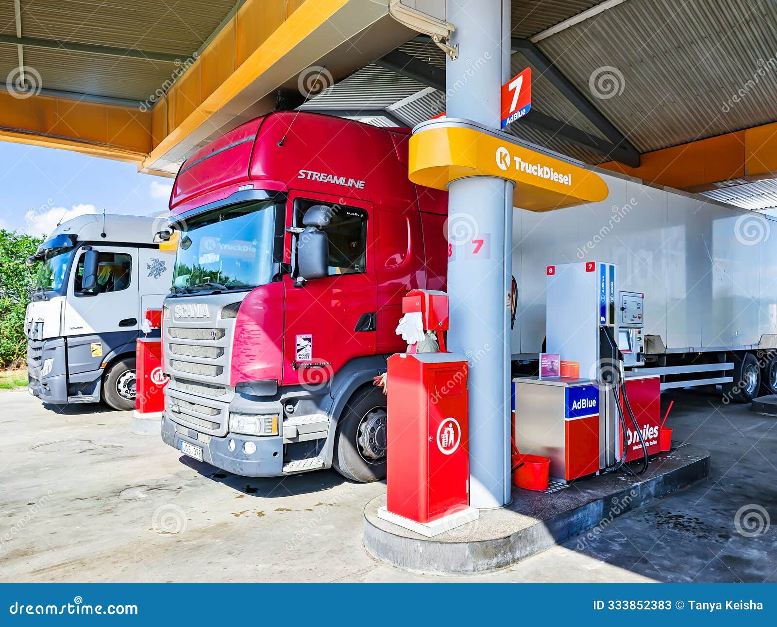 Two Scania Trucks Fill Up with Diesel Fuel at a Filling Station on the ...