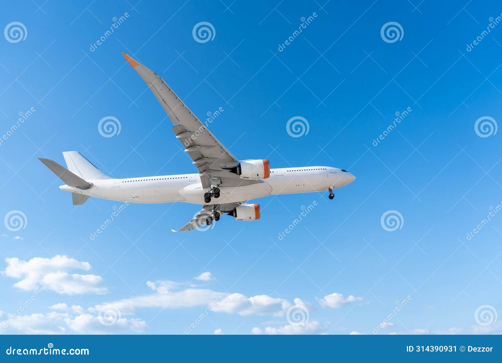 Airplane Passenger Plane with Landing Gear Extended Flying on Blue Sky ...