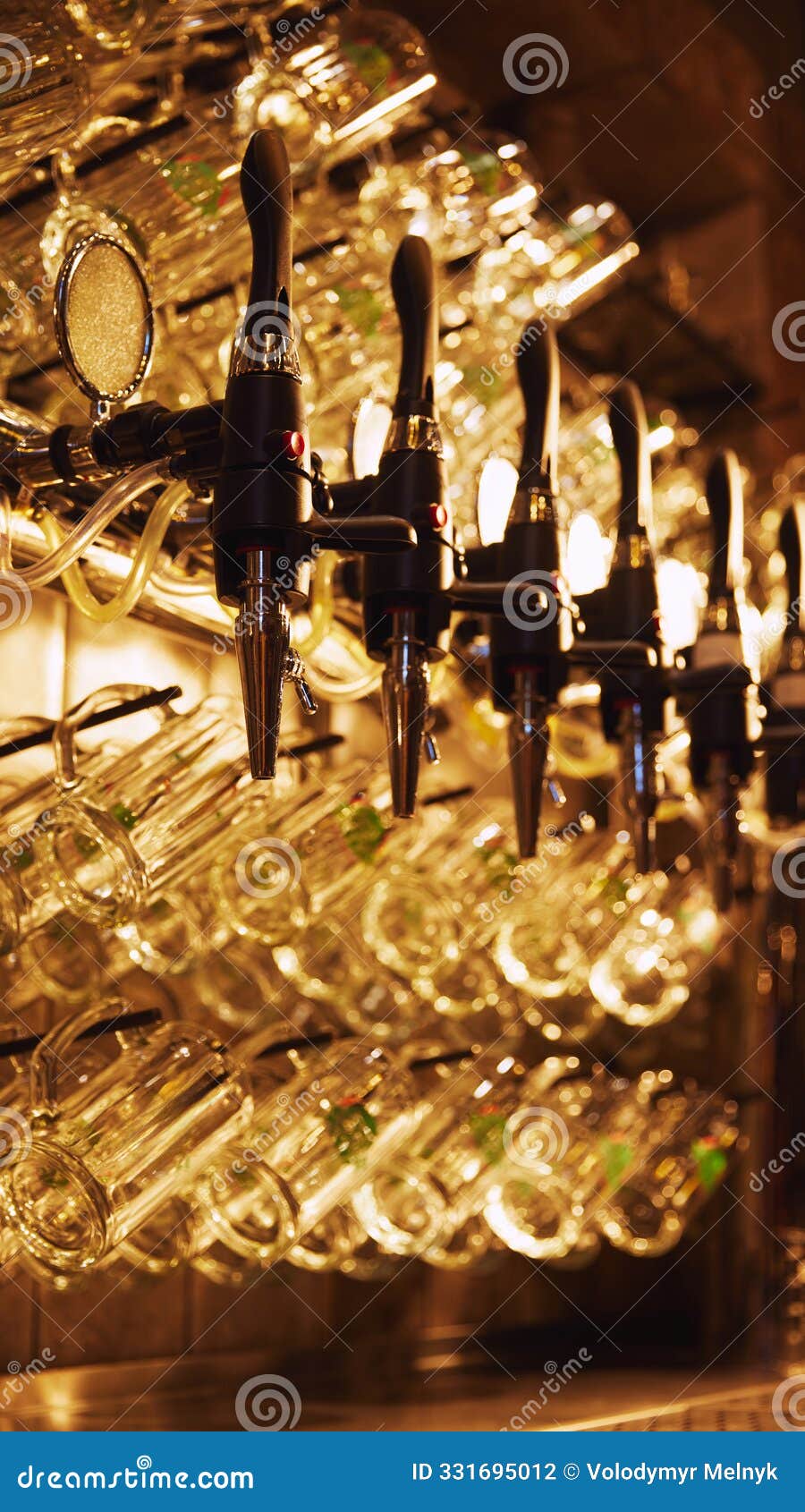 Close-up of Multiple Shiny Beer Taps with Handles, Set Against Blurred ...