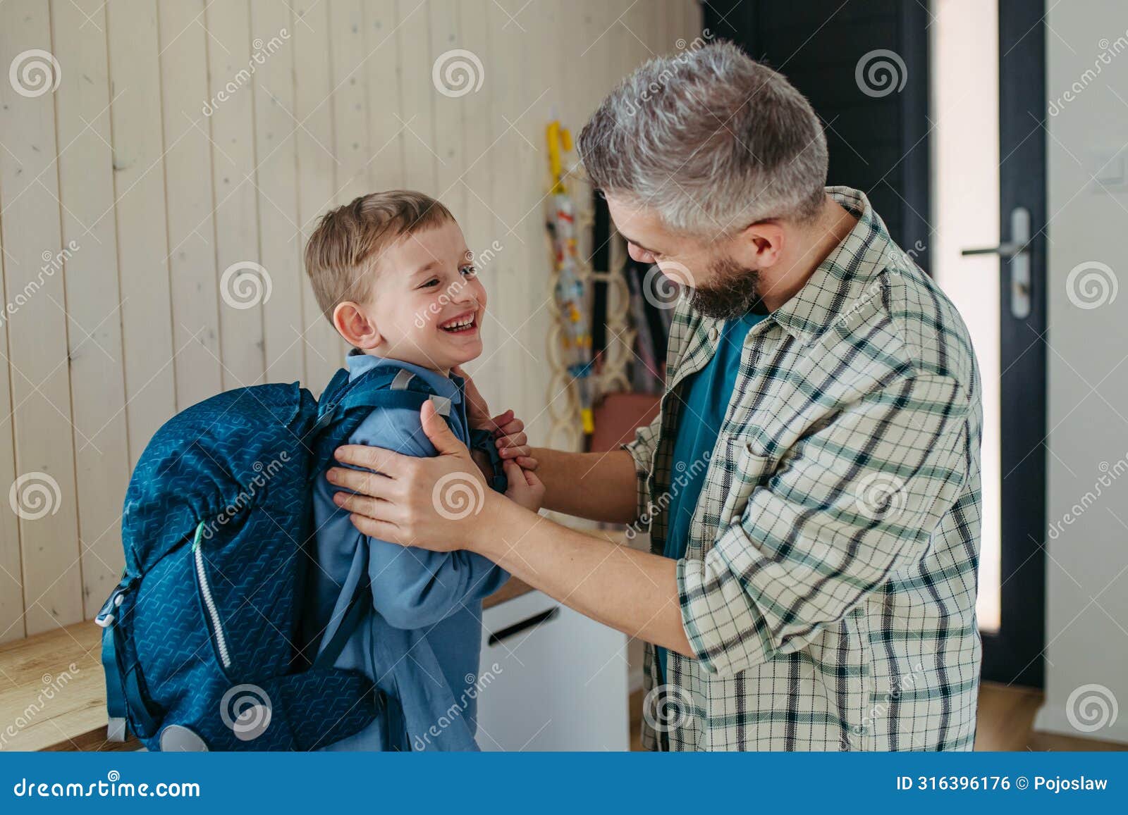 Father Helping Son Get Ready for Kindergarten, Preschool. Putting ...