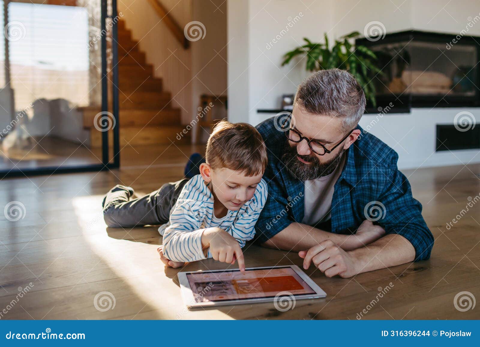 Father Showing Son Smart Home System, Adjusting Household Functions ...