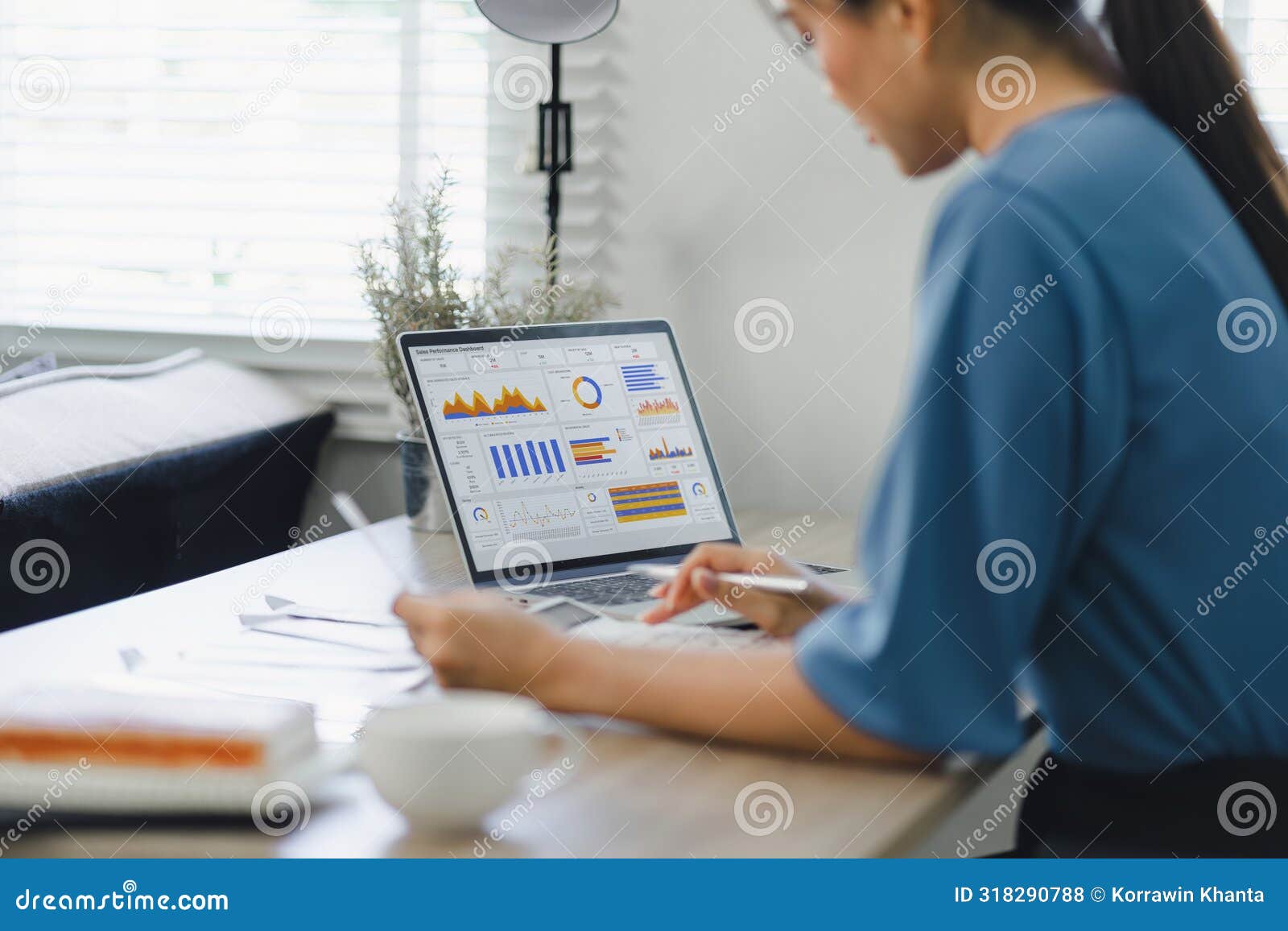 Female Analyst Analyzes KPI Business Analytics Data Dashboard ... Female Analyst Analyzes KPI Business Analytics Data Dashboard ...