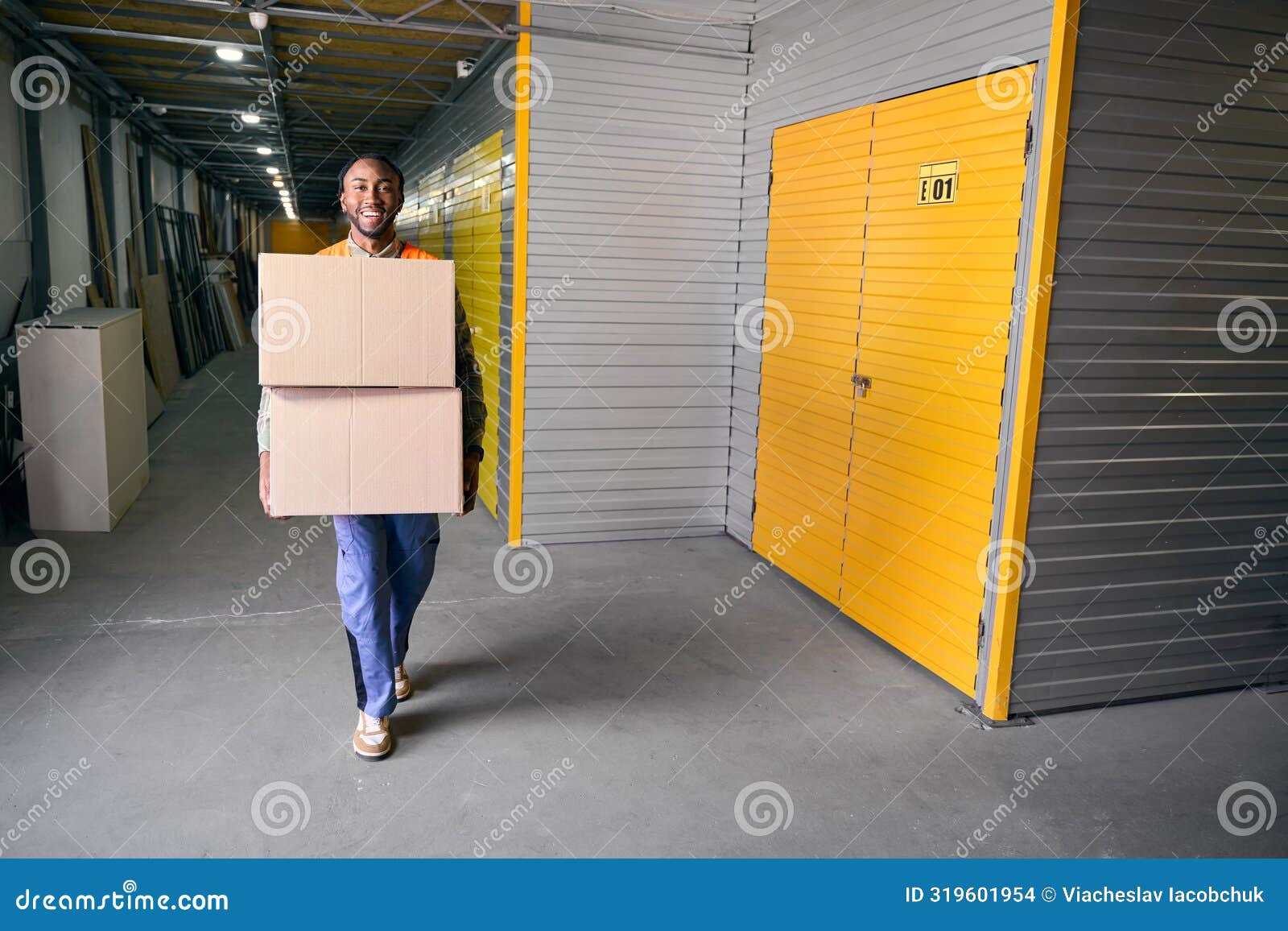 Freight Handler Posing for Camera at Work in Storage Facility Stock ...