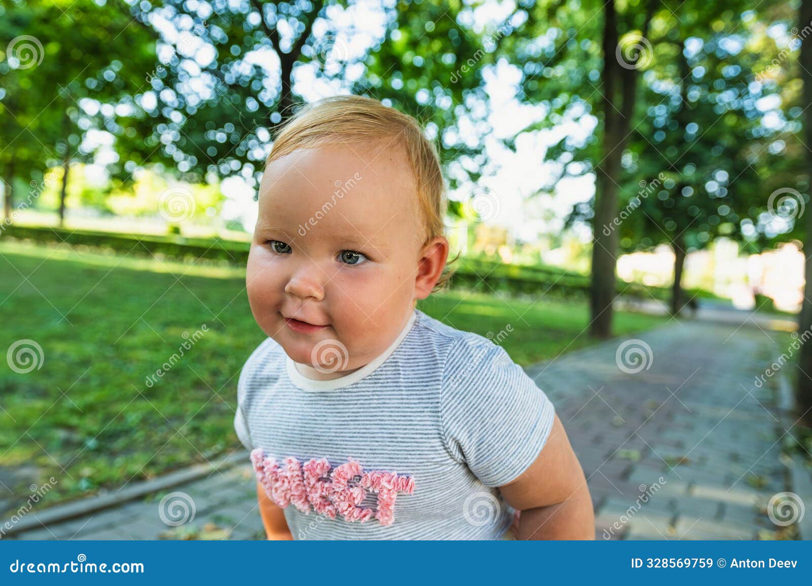 Happy Baby with Chubby Cheeks Enjoying a Bright Day in the Park ...