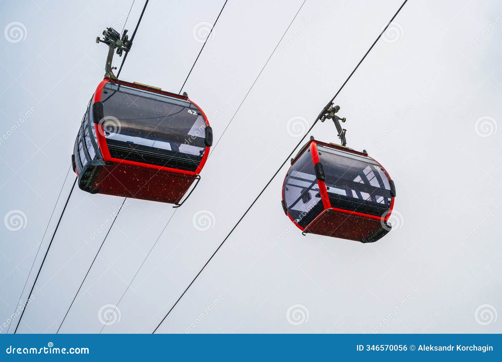 Red Cabins of the Funicular on the Cable Car in Mountains in the Fog in ...